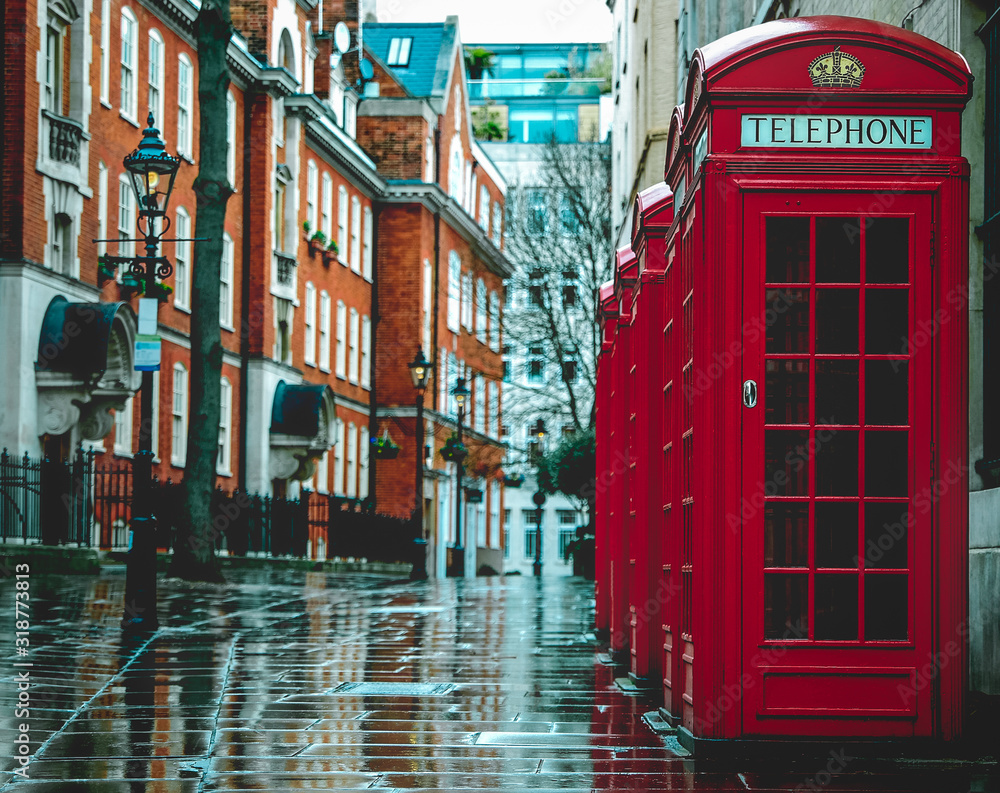 Telephone Booths By Wet Walkway In City Stock Photo | Adobe Stock