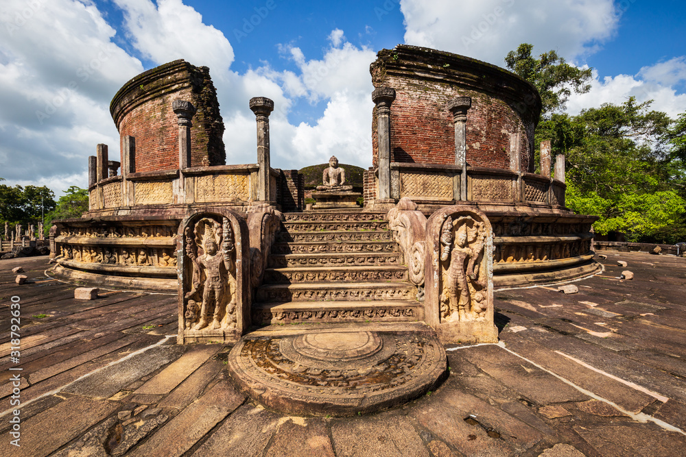 Vatadage (circular relic house) with Buddha setiing in the middle ...