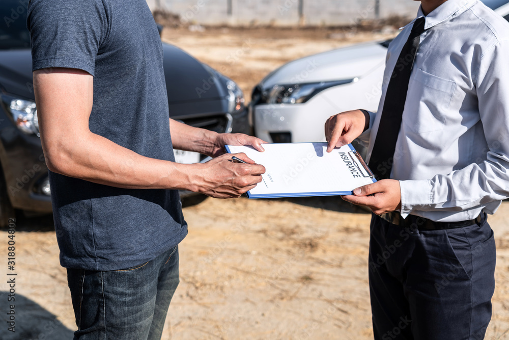 Insurance Agent and customer assessed negotiation, checking and signing ...