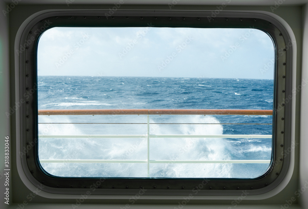 View from a cabin window of a cruise ship on the stormy sea Stock Photo ...