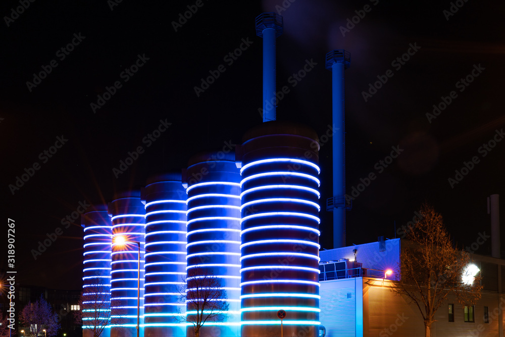 modern factory with chimneys at night. heating plant, thermal power ...