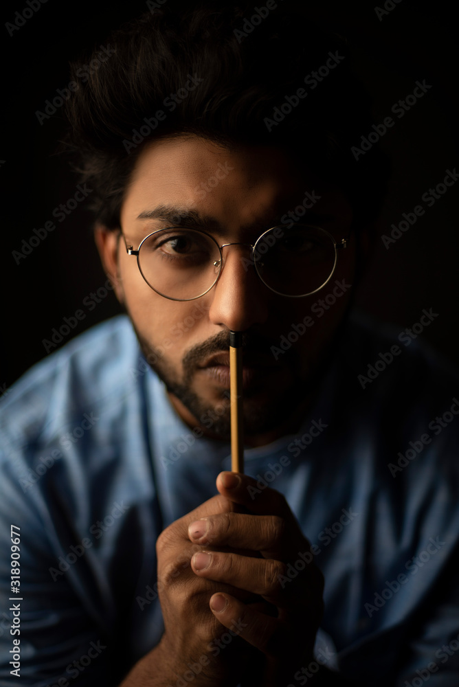 Fashion portrait of young and handsome Indian Bengali brunette man with ...