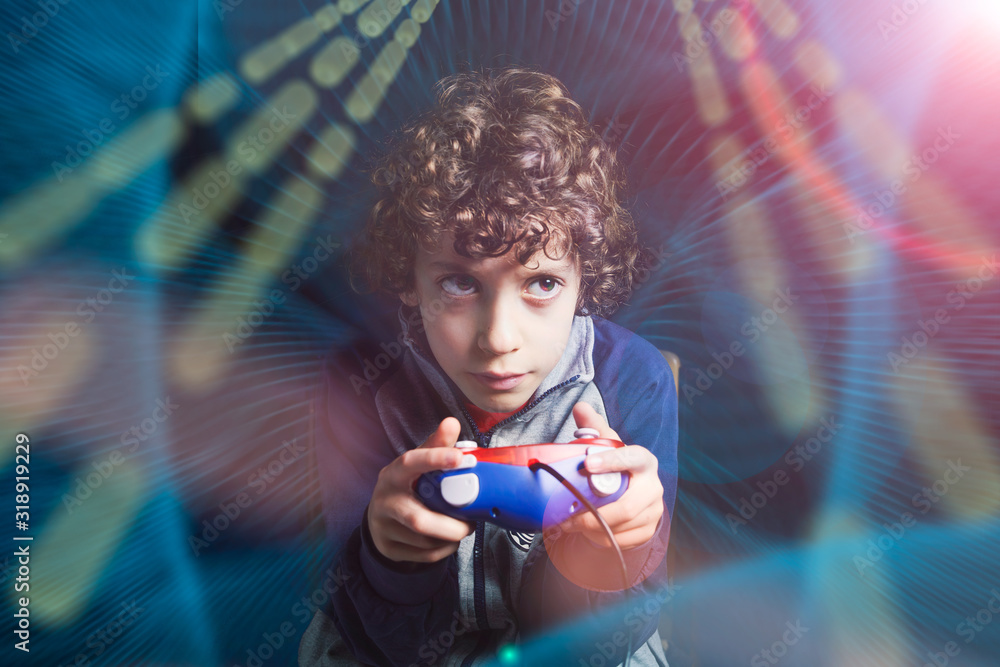 Gamer Kid. 7-8 years old child holding a console game controller ...