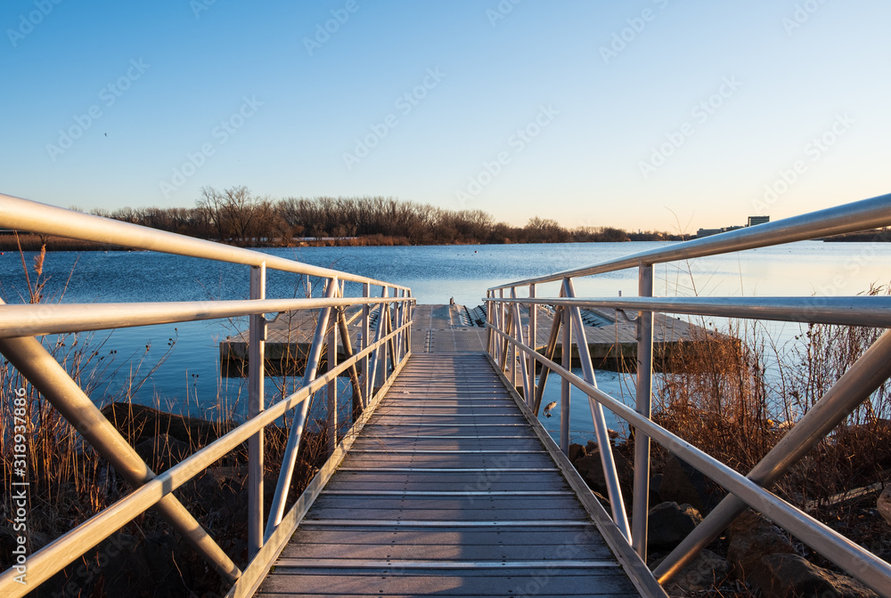 Walkway ramp to lake boat dock. Steel ramp walkway leading to boat ...