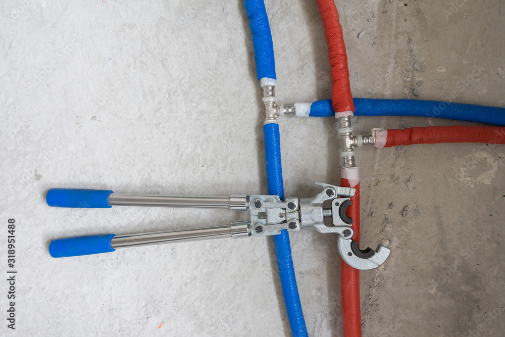 Plumbing copper pipe crimper press tube tool. Heating pipes connected ...