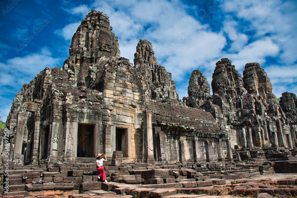 Beautiful, pretty, young Thai girl is exploring the ancient ruins of ...