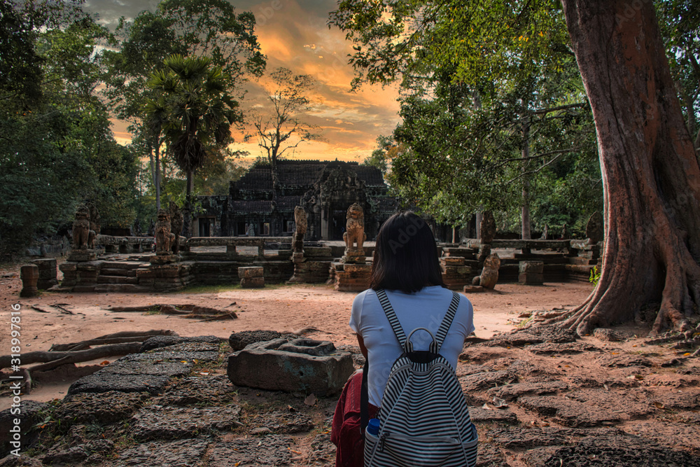 Beautiful, pretty, young Thai girl is exploring the ancient ruins of ...