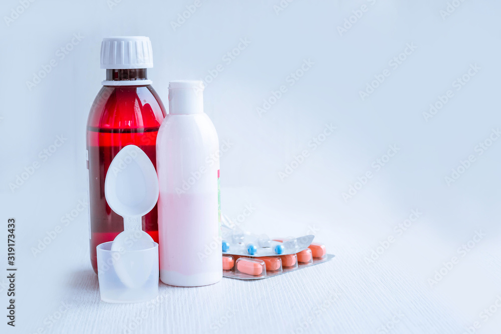 Orange thermometer and pills. Body temperature measurement. Normal ...