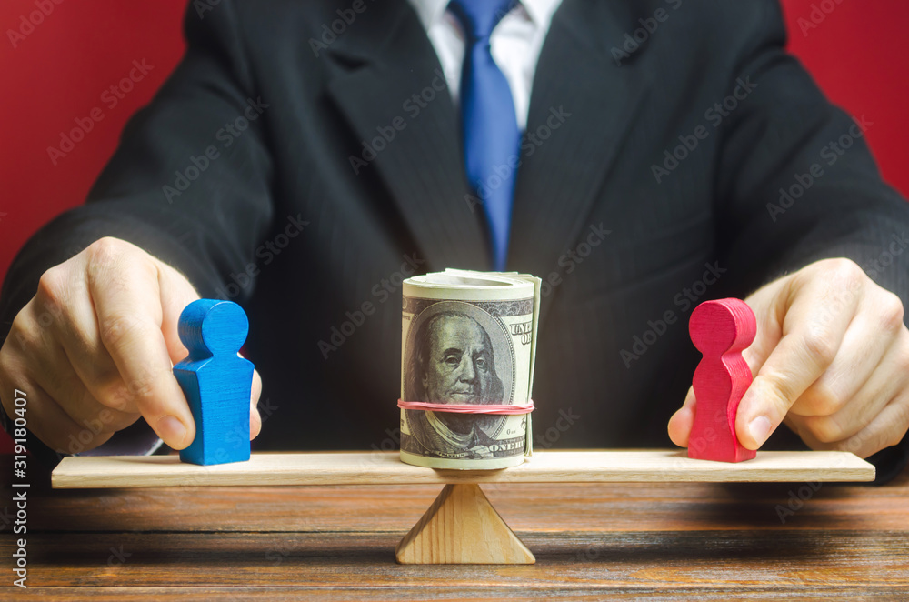 Foto de The businessman puts the figure of a man and a woman on the ...