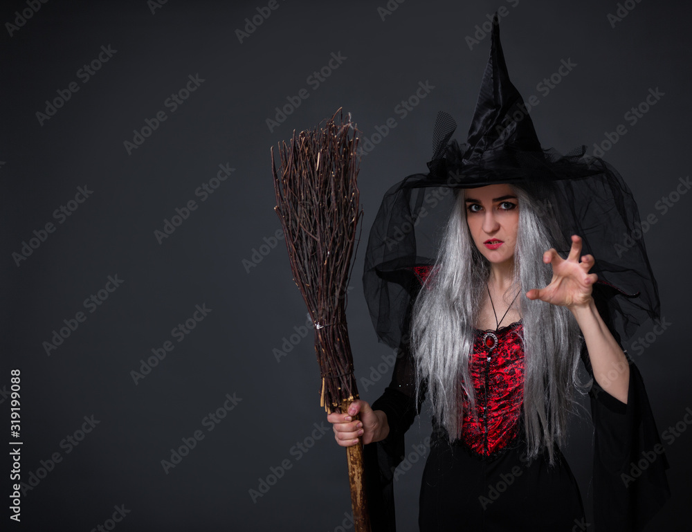 portrait of mysterious woman in black witch halloween costume posing ...