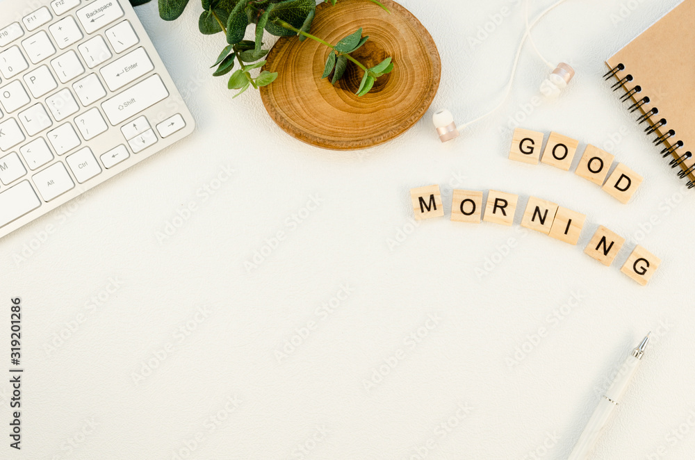 Good Morning wooden cubes text on a designer's Clean White office desk ...