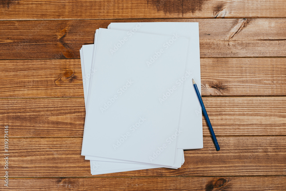 Top view of modern desk office workplace with a4 paper. Blank branding ...