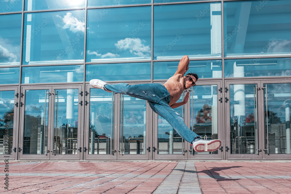 man in a jump on twine, muscular torso, dancer, young guy, city summer ...