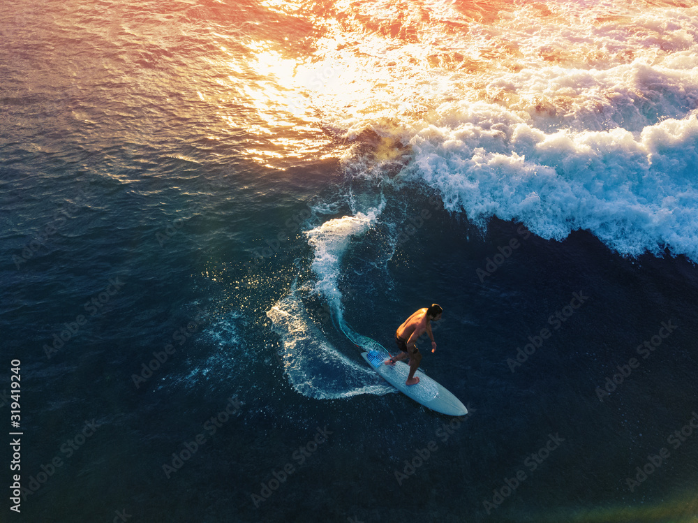 Surfer rides the ocean wave Stock Photo | Adobe Stock