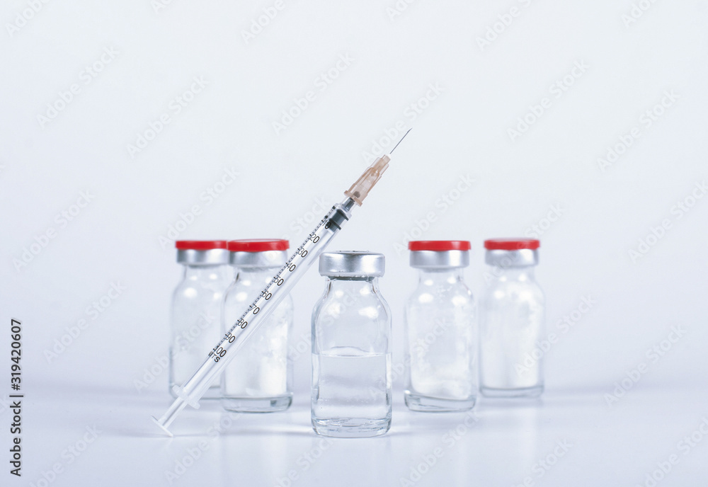 syringe and glass vials with medicine for injection close-up Stock ...