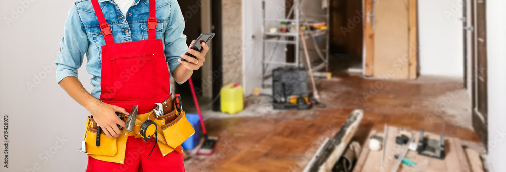 Builder handyman with construction tools. House renovation background ...