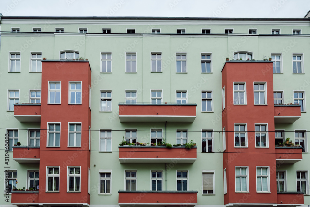 Front view of the facade of a renovated old apartment building in ...