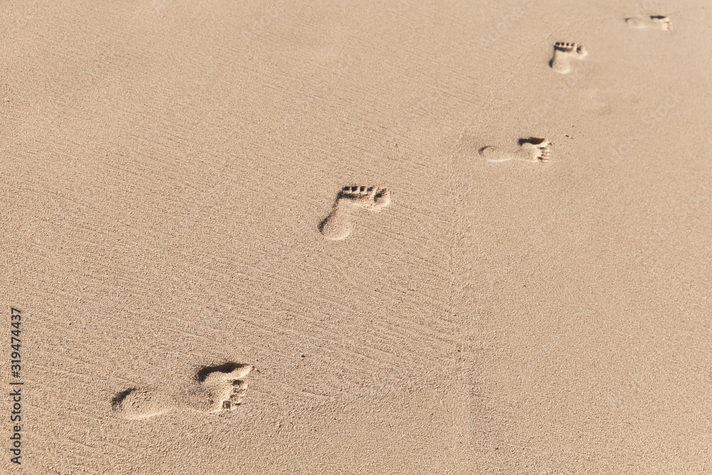 Footprints of a single walking man, bare feet imprints Stock Photo ...