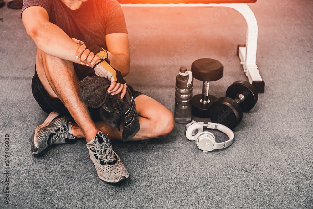 muscular caucasian young man taking a break relax after workout for ...