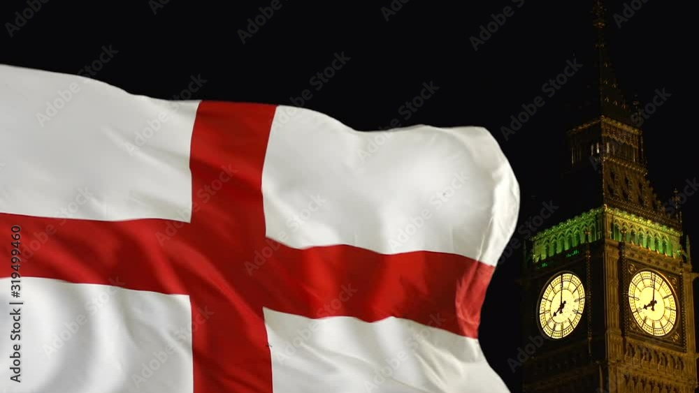 Big Ben in London, UK at night. The English flag is waving next to the ...