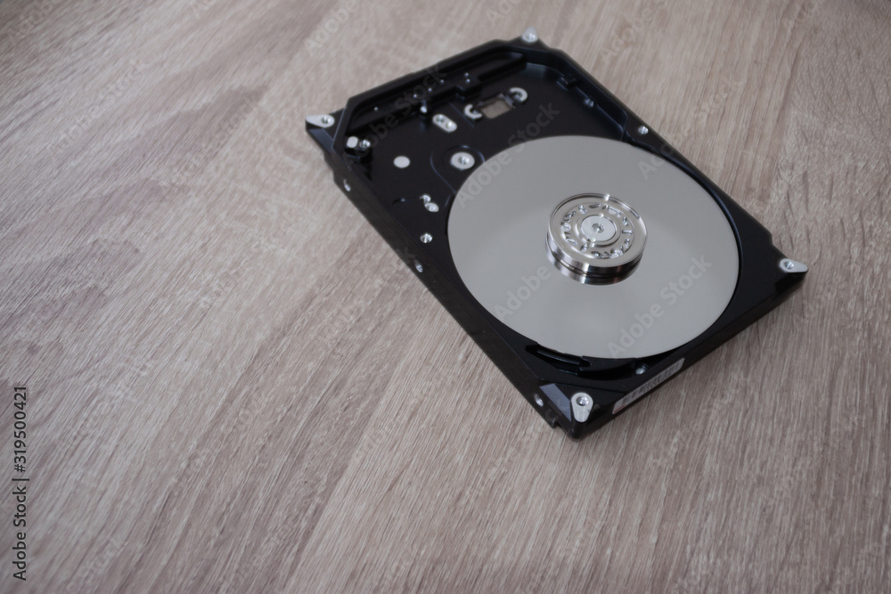 Disassembled computer hard drive device close-up. Dismantling ...