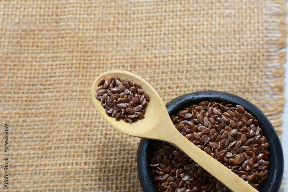 natural flaxseed seeds displayed in containers Stock Photo | Adobe Stock