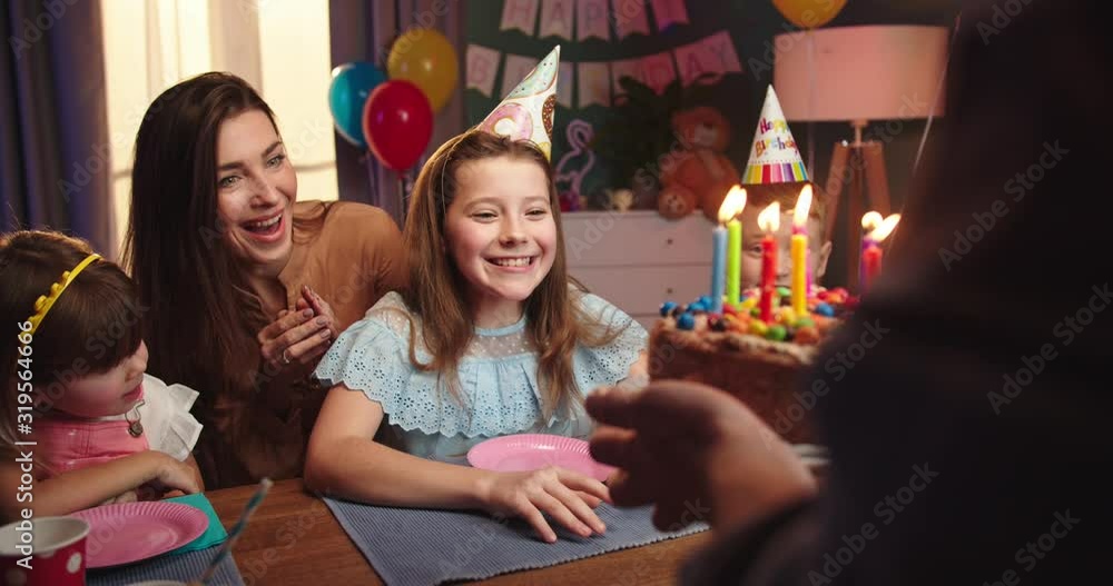 Video Stock Pretty little Caucasian girl with her friends and mother ...