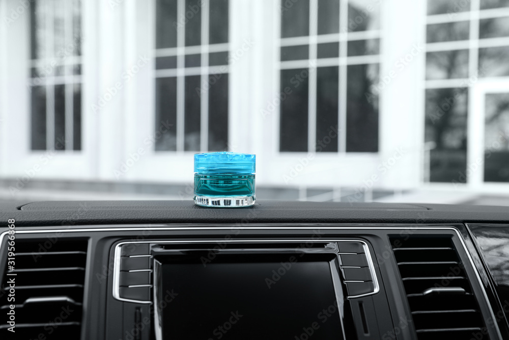 Stylish air freshener on dashboard in car Stock Photo | Adobe Stock
