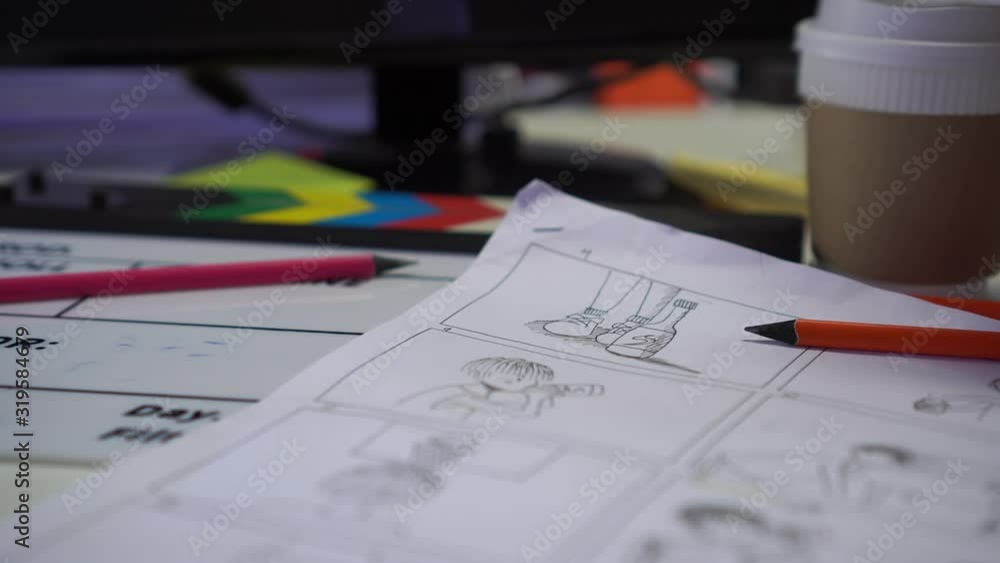 Designer creative drawing in storyboard for film movie, Video Pre ...