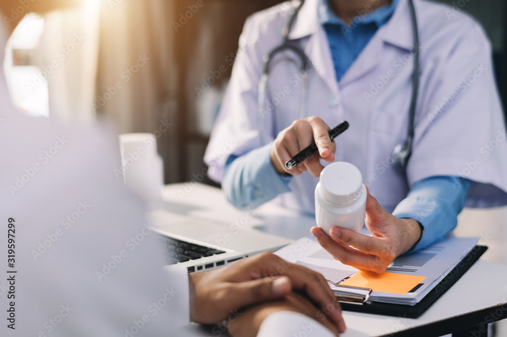 Doctors explain the use of medication to patients. healthcare and ...