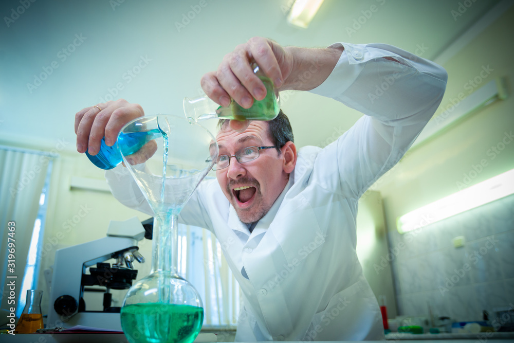 Chemist crazy. A mad scientist conducts experiments in a scientific ...