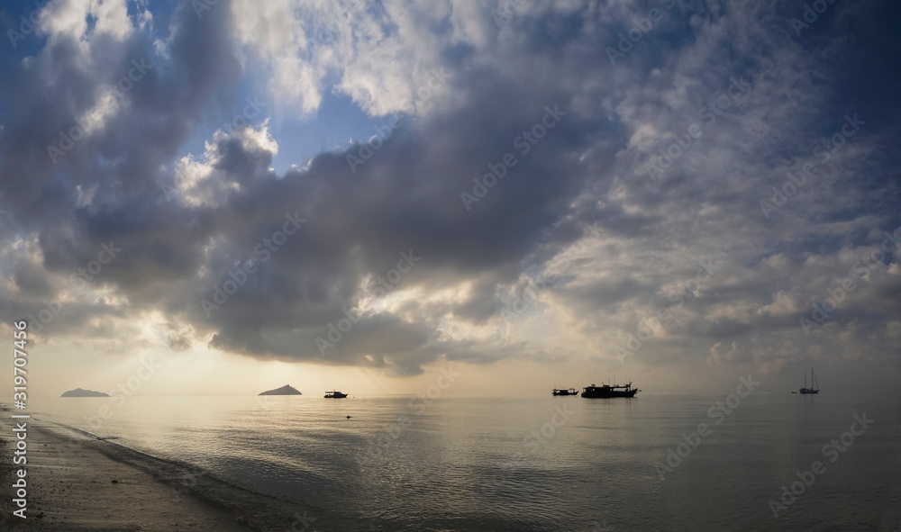 view seaside morning of small boats floating in the sea with small ...