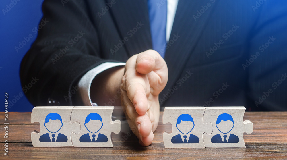 A man divides puzzle team of employees. Team split, structural ...