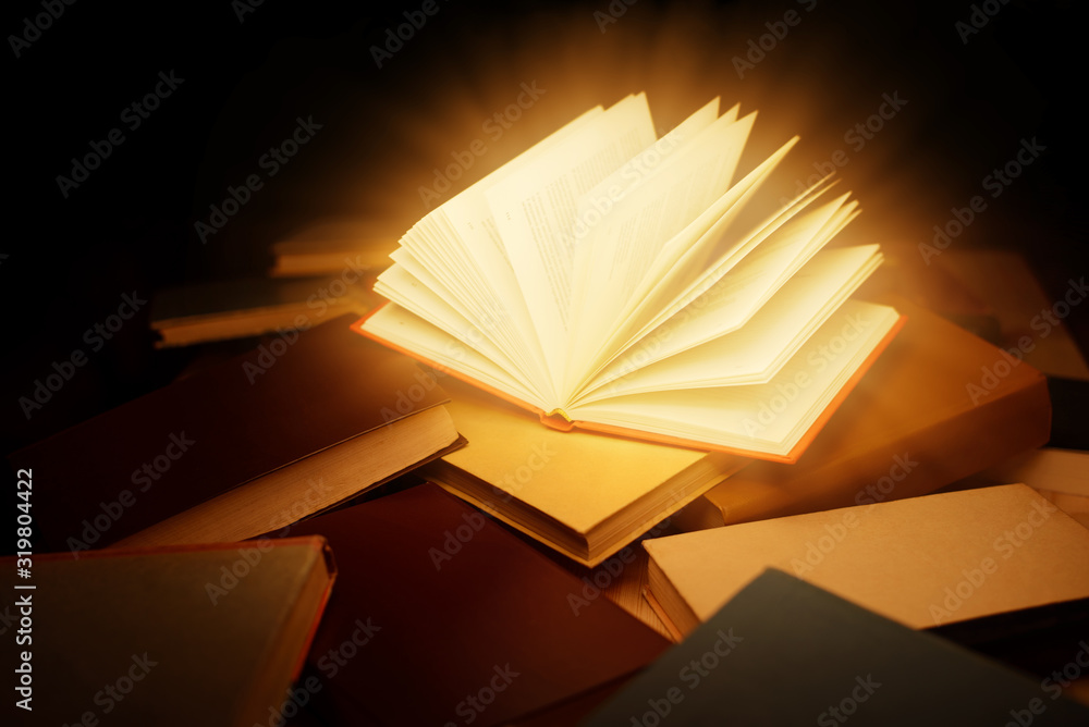 Bright light coming from open book, making image overexposed. Open book ...