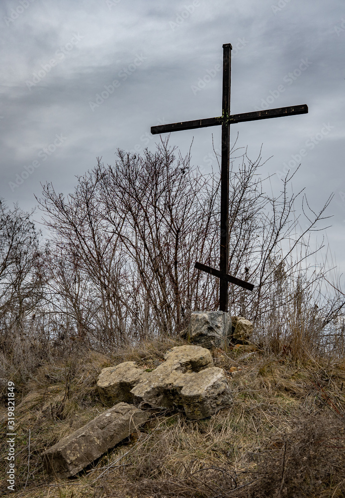 Old stone church cross near an abandoned ruined church Stock Photo ...
