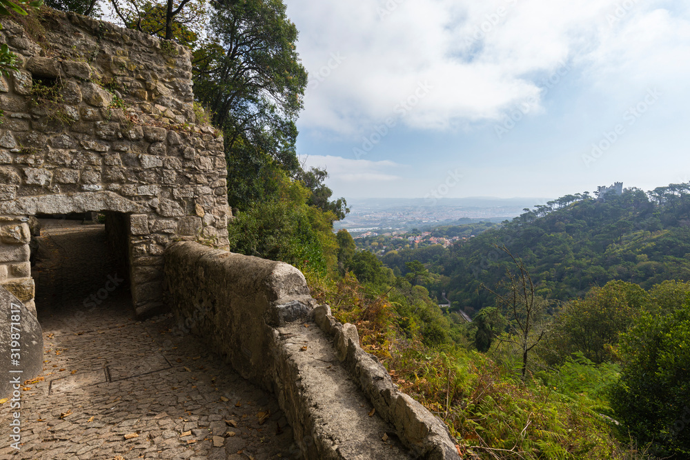 Part of the surrounding wall and footpath to medieval hilltop castle ...