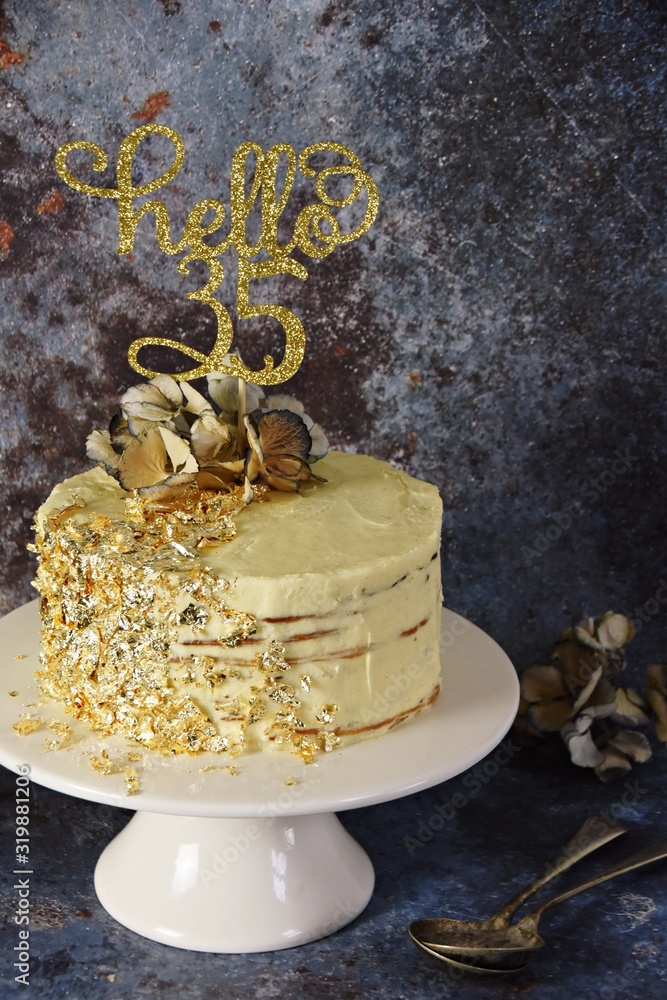 A great white and gold birthday cake for thirty-five years. Birthday ...