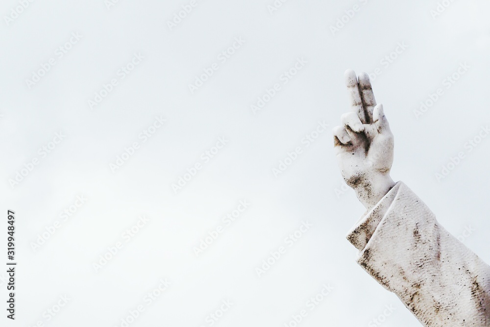 ARM OF A STATUE AGAINST WHITE BACKGROUND Stock Photo | Adobe Stock