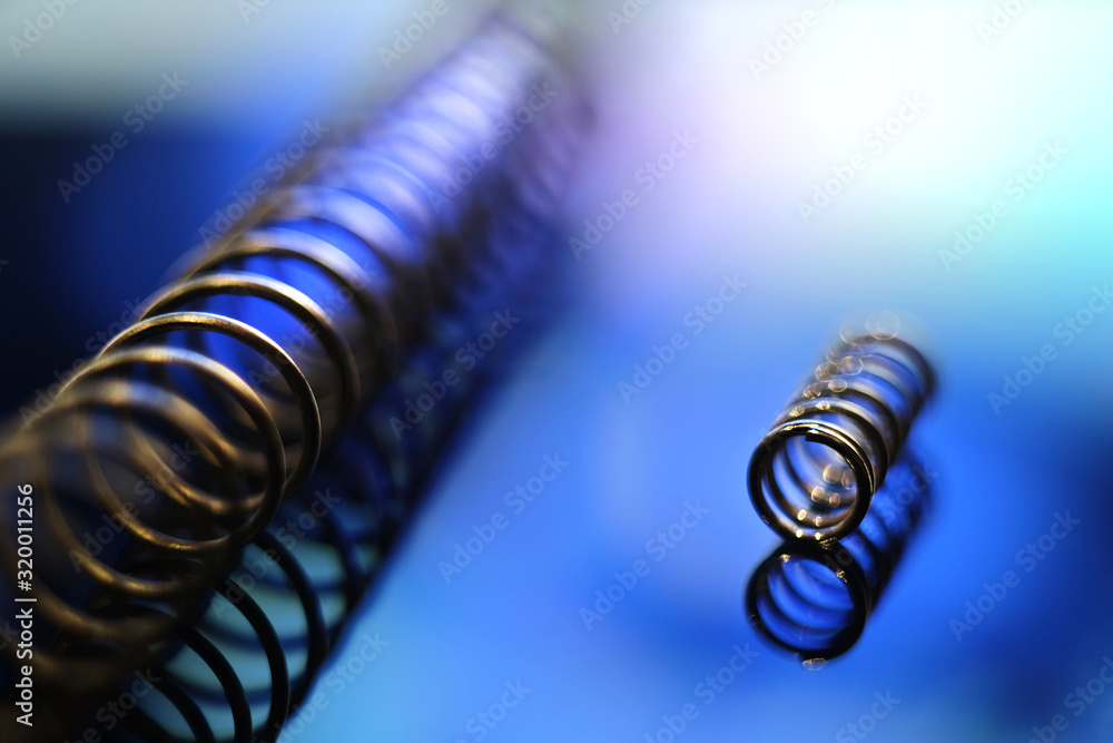 Iron spirals in blur. Shiny metal springs in blur. Stock Photo | Adobe ...