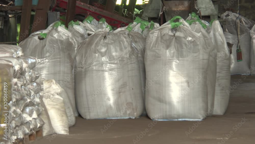 Soda ash in jumbo bags are store in warehouse. Stacking of bulk cargo ...