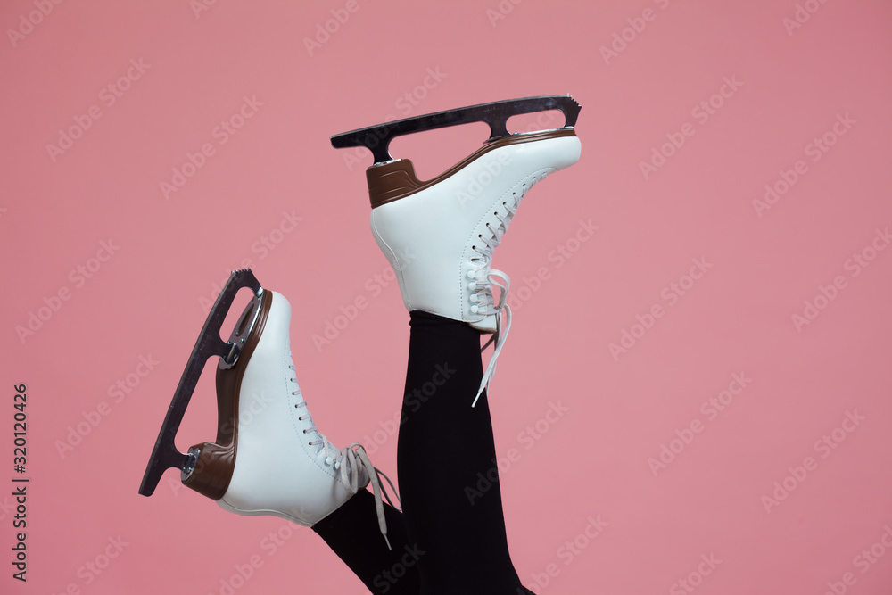 Figure skating is a winter sport and leisure. Women's feet in ice ...