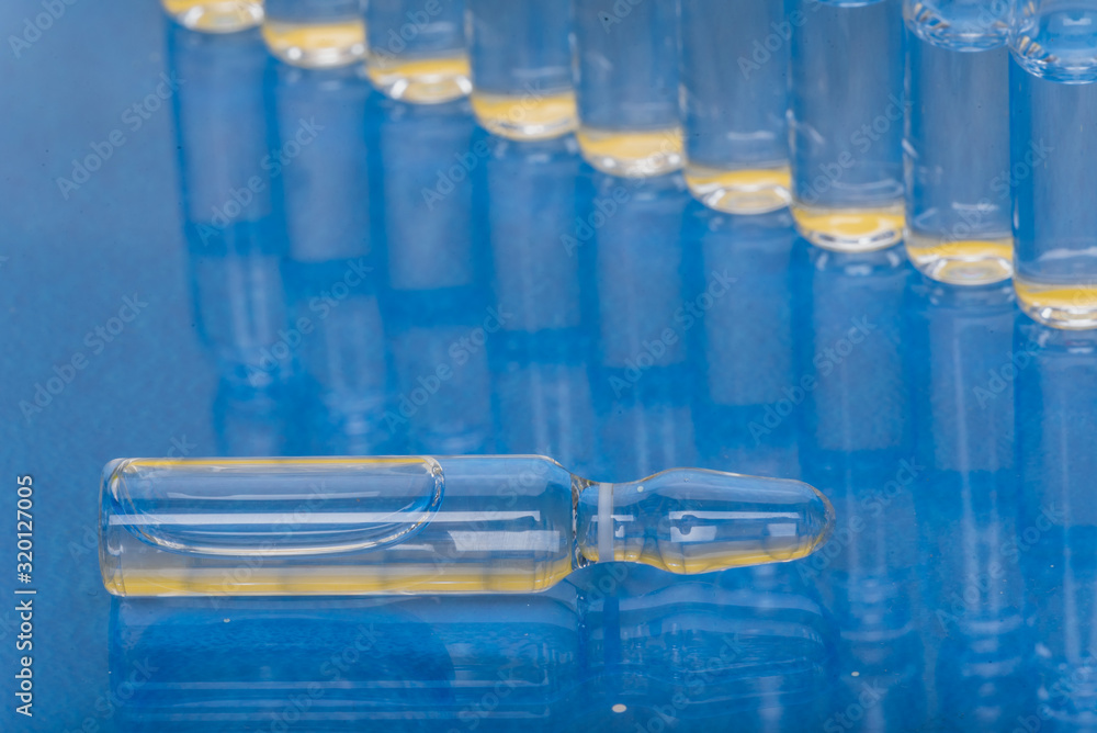 Glass medical ampoule vial for injection. Medicine is liquid sodium ...