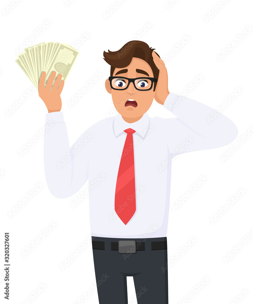 Shocked businessman showing cash, money and holding hand on head ...