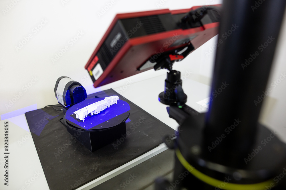 Professional 3D scanner scanning an industrial object, plastic molding ...