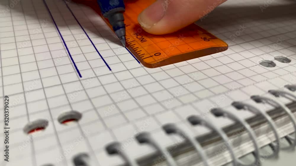 Draw lines with a ruler on a piece of paper in a notepad Stock ビデオ ...