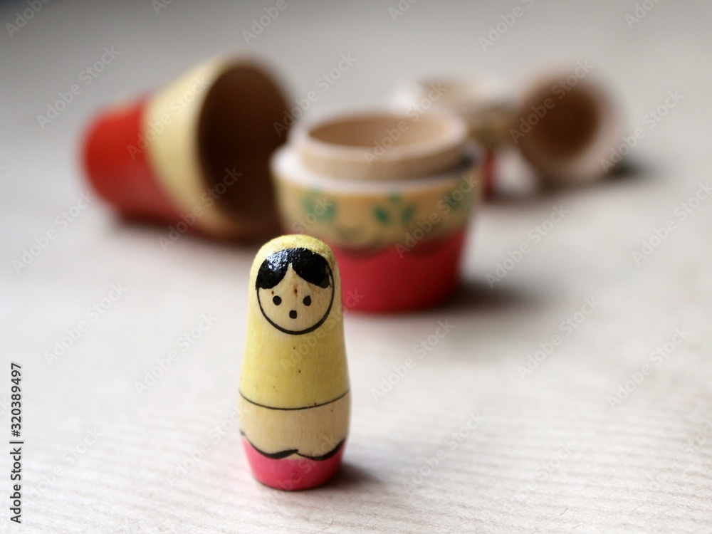 Wooden Russian matryoshka dolls in folk style, girls with painted ...