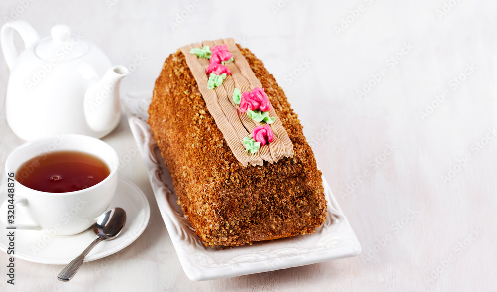 Roulade cake decorated with colourful buttercream flowers. Yule Log ...