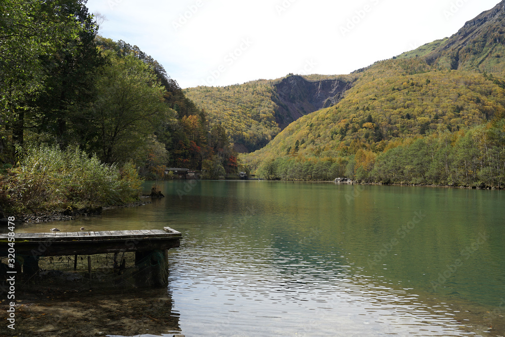 Beautiful crystal clear water landscape at Taisho pond with mountain ...