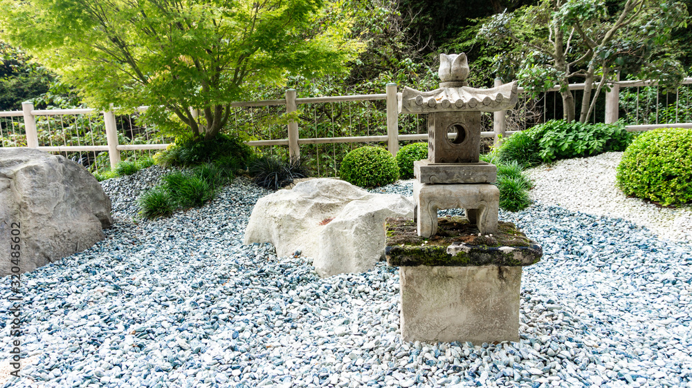 A picturesque photography of a Japanese-style stone garden with ...