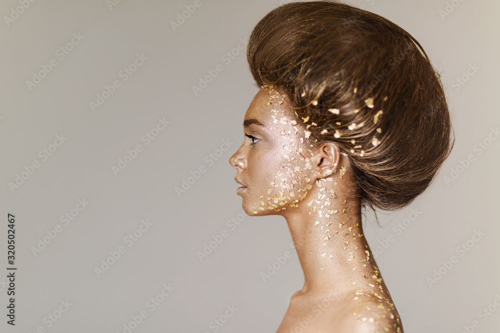 Fashion art portrait of model girl with holiday golden shiny ...